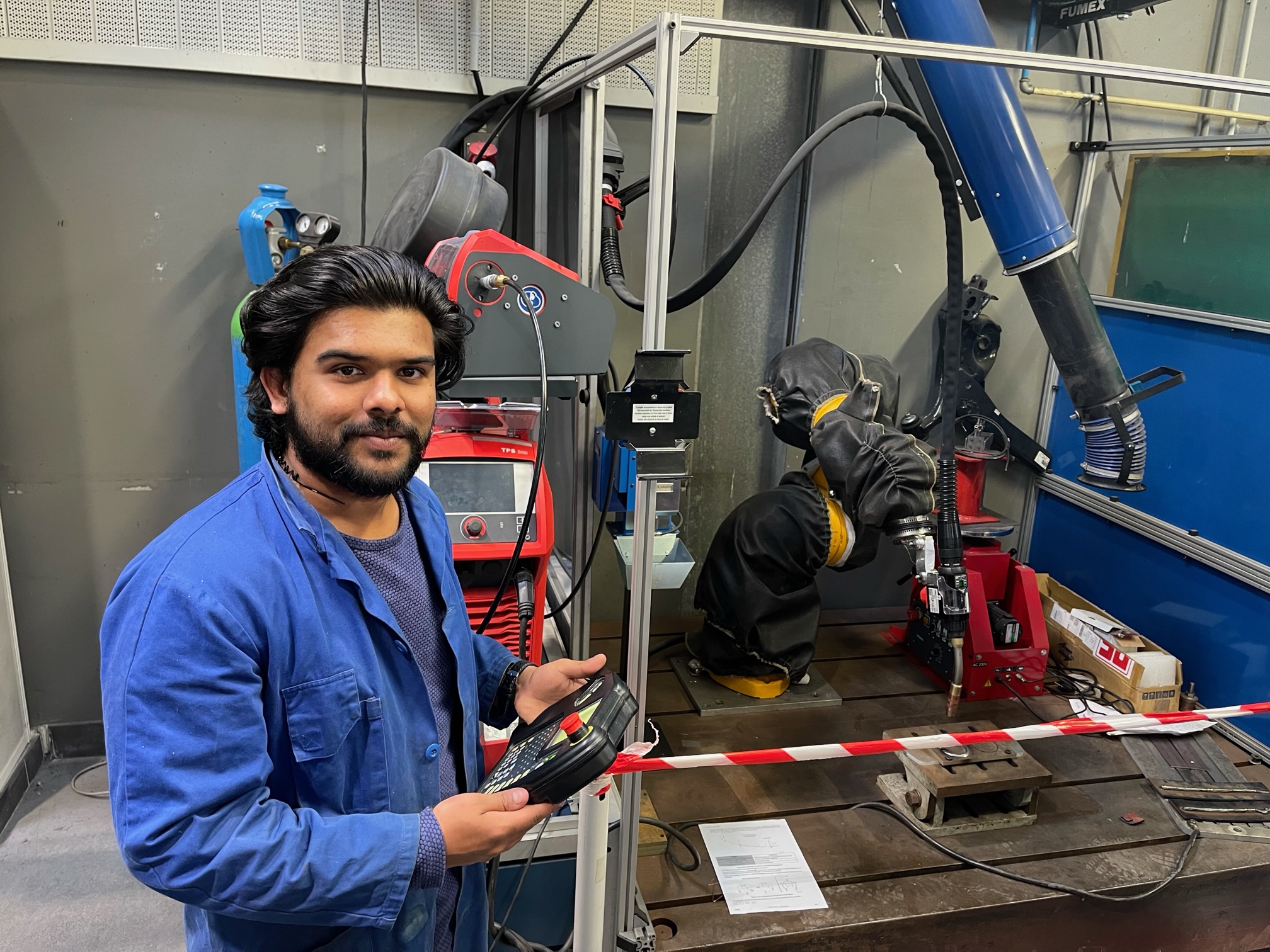 Design and implementation of a robotic cell using a Cable–Driven ...